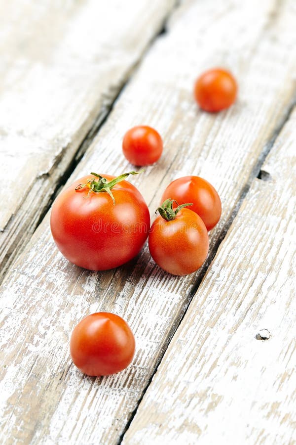 Fresh Red Tomatoes on an Old Wooden Tabletop Stock Photo - Image of ...