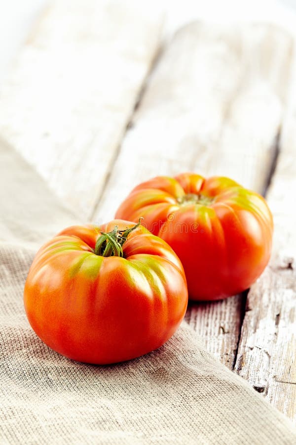 Fresh Red Tomatoes on an Old Wooden Tabletop Stock Image - Image of ...