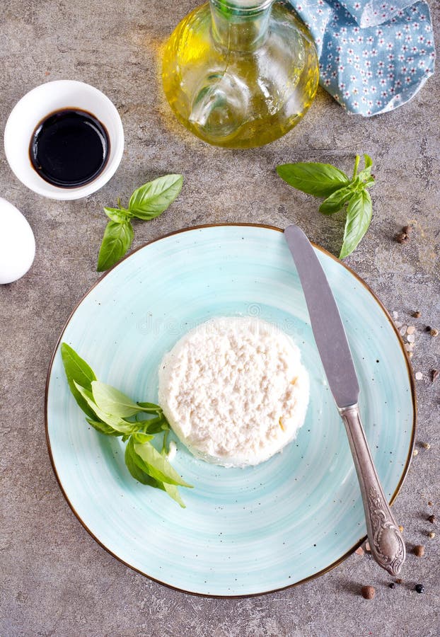 A Fresh Ricotta with Basil Leaf on Stone Table Stock Photo - Image of ...