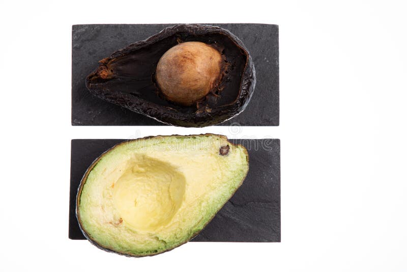Fresh and Ripe Avocado Next To Rotting Avocado Cut in Half with Seed ...