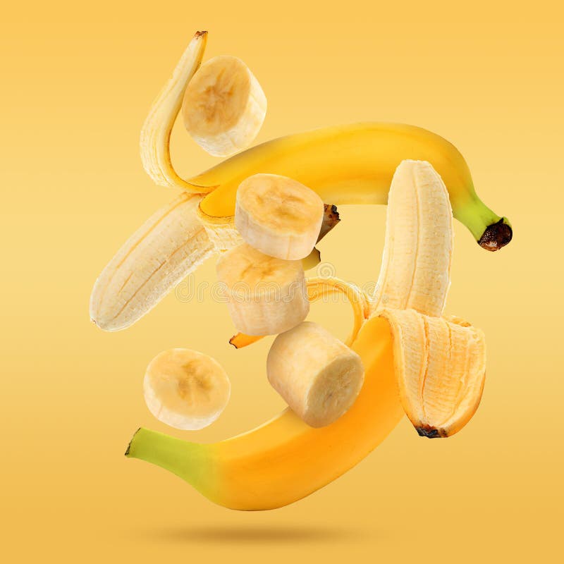 Fresh Ripe Bananas Falling on Golden Background Stock Image - Image of ...