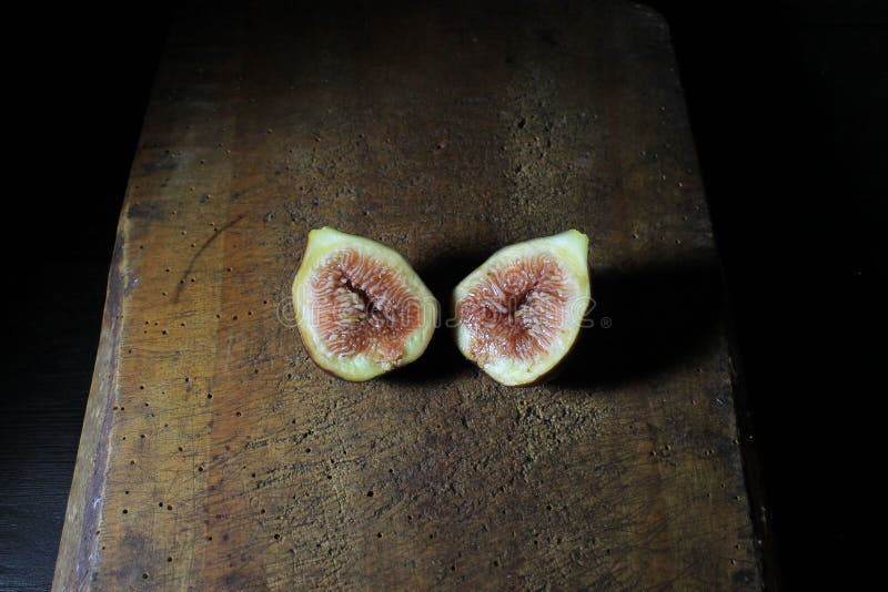 Fresh Ripe Fig Cut in Half on a Wooden Table Stock Photo - Image of ...