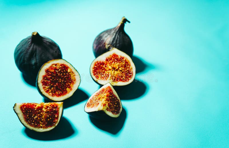 Fresh Ripe Figs on a Blue Background. Sweet Sliced Figs on the Table ...