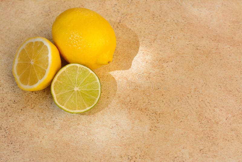 Fresh Ripe Lemons and Lime on Light Table, Top View. Space for Text ...