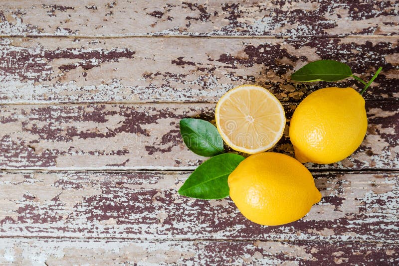 Fresh Ripe Lemons on Wooden Table. Stock Photo - Image of lime, leaf ...