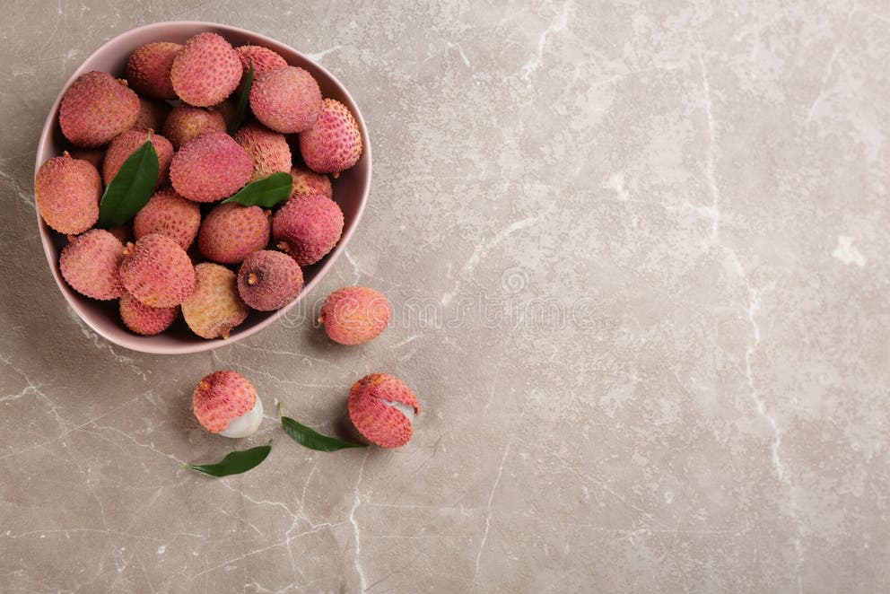 Fresh Ripe Lychee Fruits on Grey Table, Flat Lay. Space for Text Stock ...