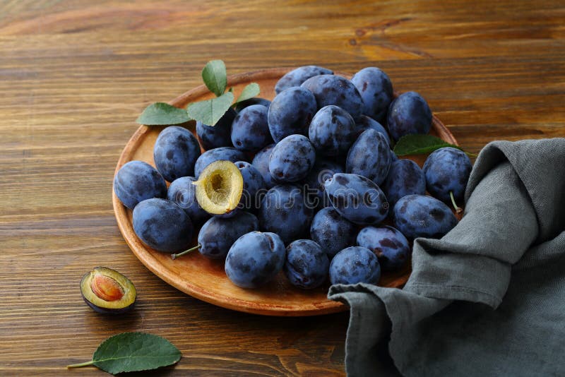 Fresh ripe prune on plate stock image. Image of plums - 81546837