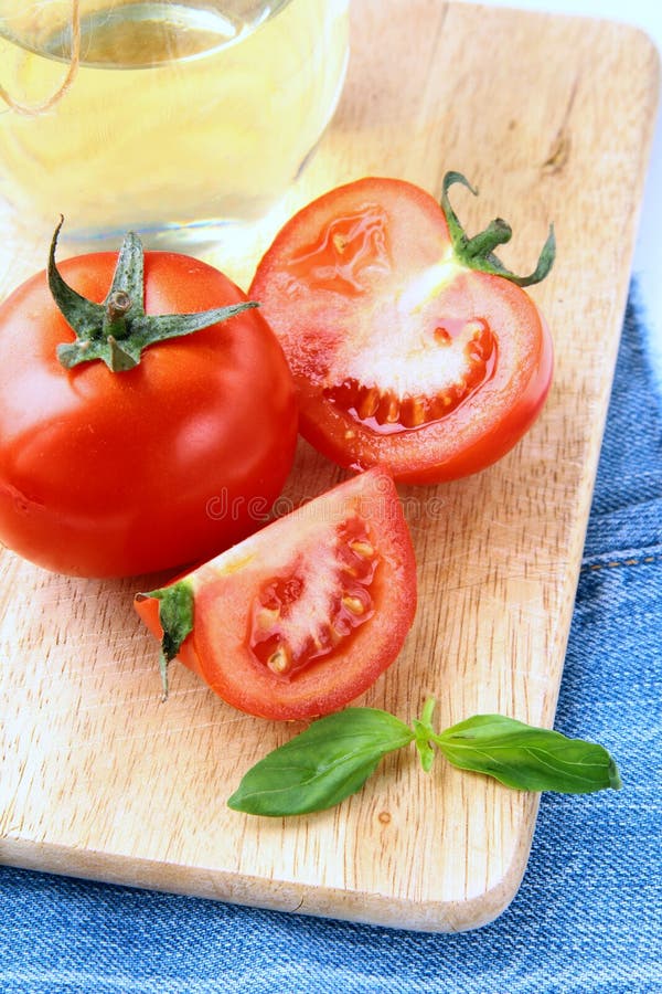 Fresh Ripe Tomatoes with Basil Stock Image - Image of kitchen, stalks ...
