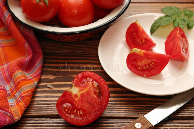 Fresh Ripe Tomatoes in Bowl, Half of Cutted Tomato Stock Photo - Image ...