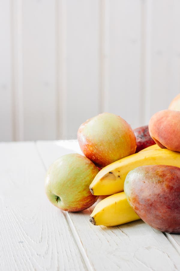 Fresh and Ripes Fruits - Banana, Mango, Peach and Apples on a Table ...