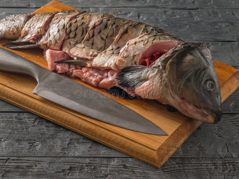Fresh River Fish on the Board with a Knife. Stock Image - Image of ...