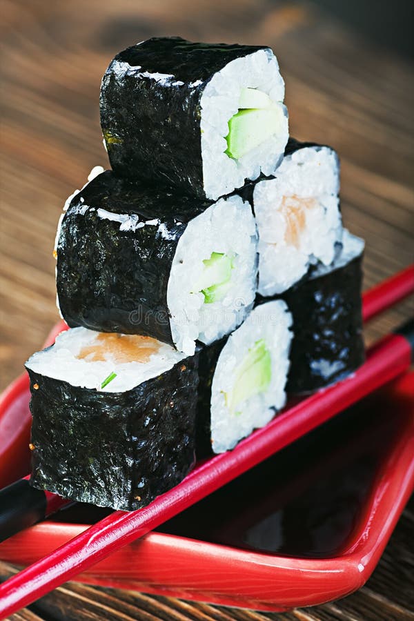 Fresh Roll Served in a Red Plate with Black Stripes Stock Image - Image ...