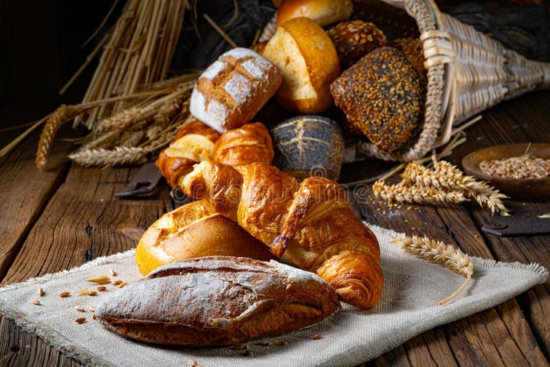 Fresh Rolls in a Cornucopia Stock Photo - Image of board, cake: 200771048