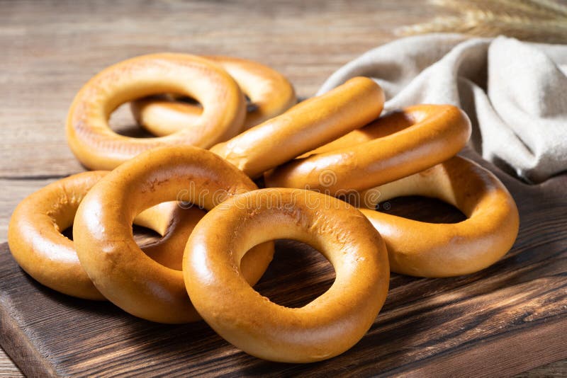 Fresh Round Bagels of Wheat Flour on a Wooden Table Stock Photo - Image ...