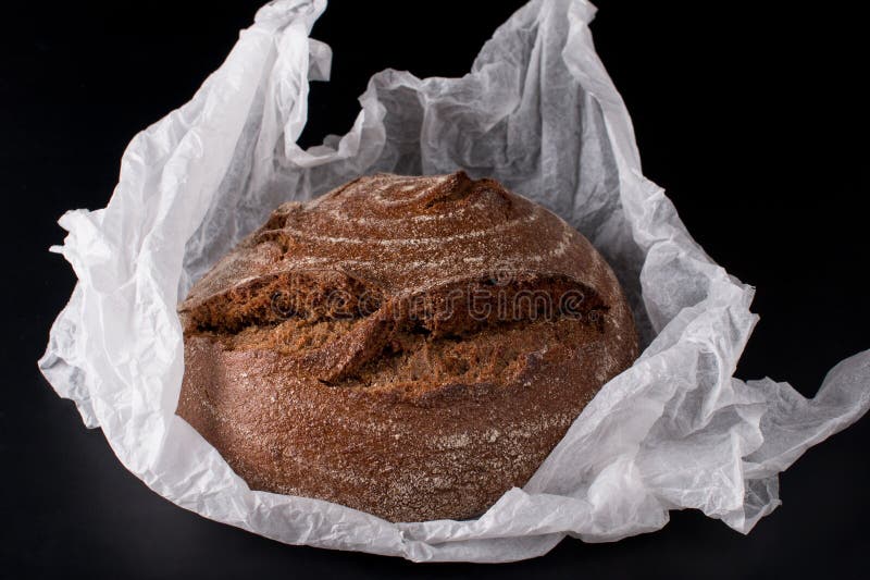 Fresh Round Black Bread with a Crispy Crust, Garlic Baguette White and ...