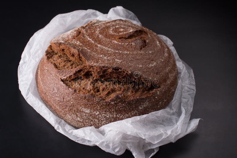 Fresh Round Black Bread with a Crispy Crust, Garlic Baguette White and ...