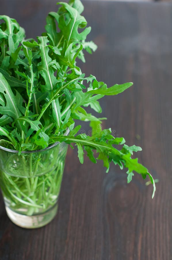 Fresh Ruccola Leaves on the Wooden Background Stock Image - Image of ...