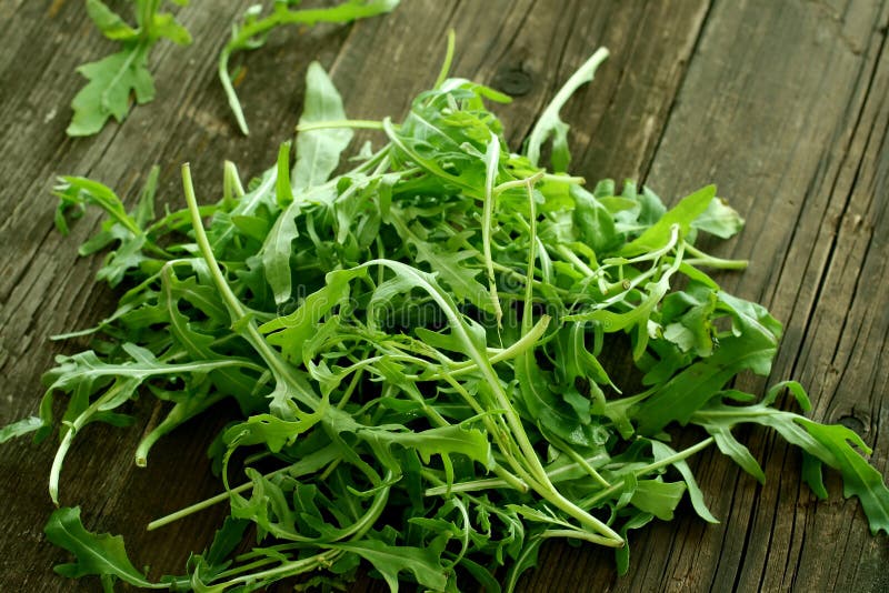 Fresh Rucola on a Old Wooden Stock Image - Image of wood, agriculture ...