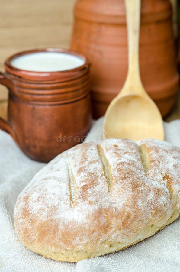 Fresh Rustic Bread with Cup of Milk and Wooden Spoon Stock Image ...