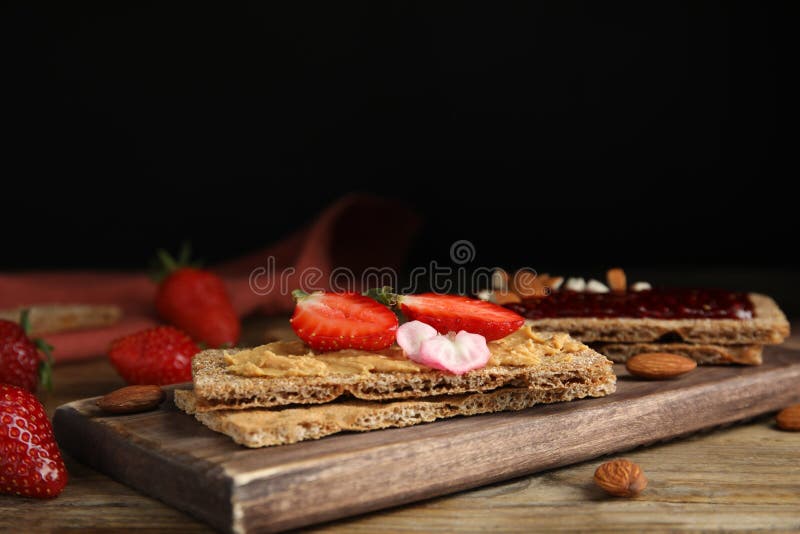 Fresh Rye Crispbreads with Different Toppings on Wooden Table. Space ...