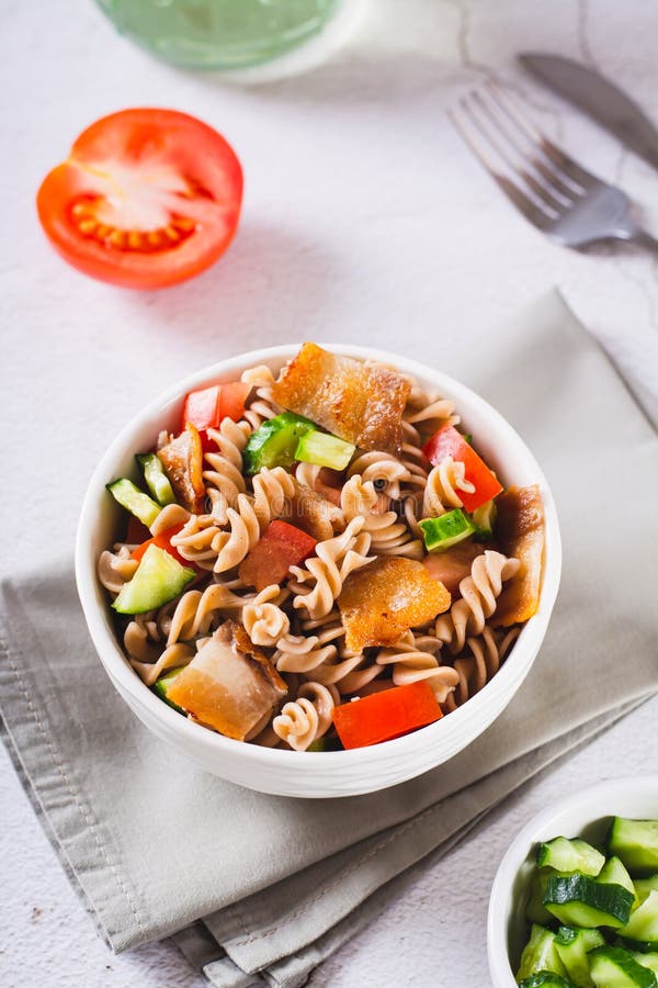 Fresh Salad of Buckwheat Pasta, Tomatoes, Cucumbers and Fried Bacon in ...