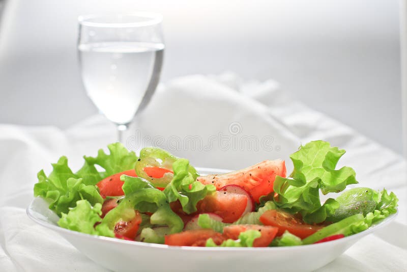 Fresh Salad with a Glass of Water Stock Photo - Image of plate, tomato ...