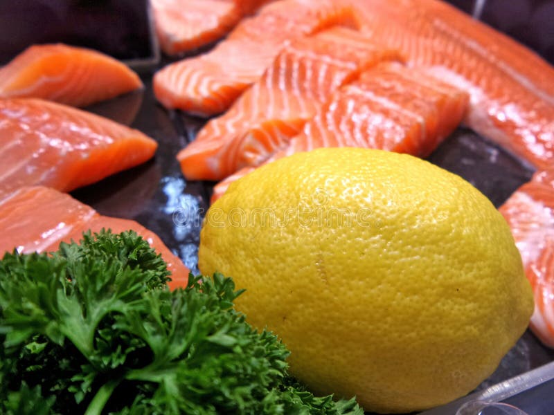 Fresh Salmon and Yellow Lemon and Green Parsley Stock Photo - Image of ...