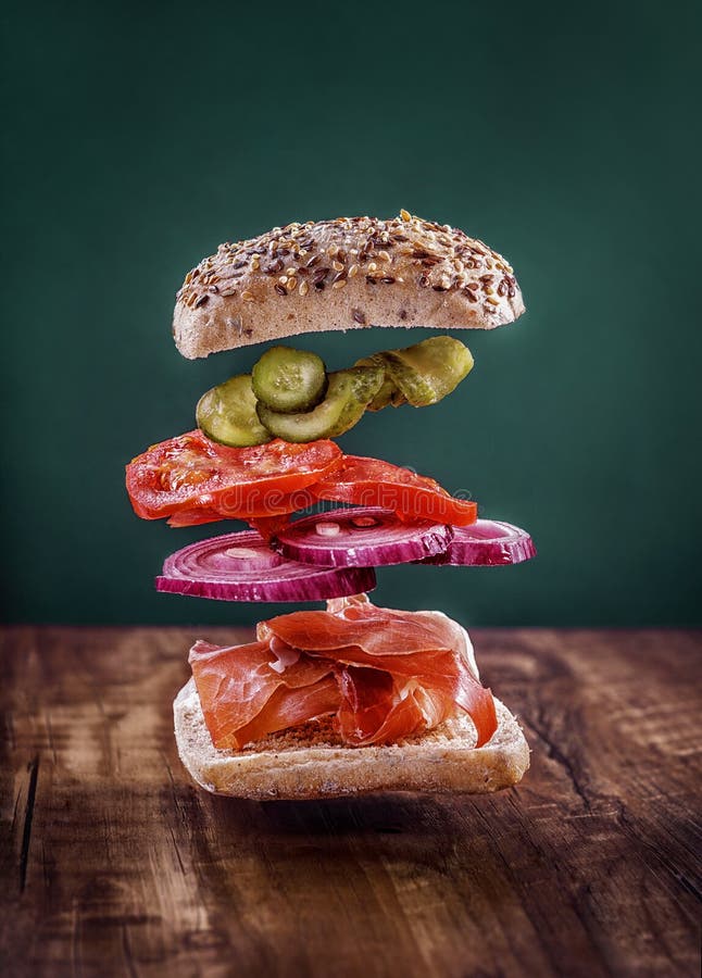 Sandwich Floating on Wooden Table Stock Photo - Image of delicious ...