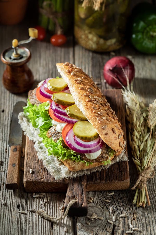 Fresh Sandwich with Roasted Pork Neck, Gherkins and Onion Stock Image ...