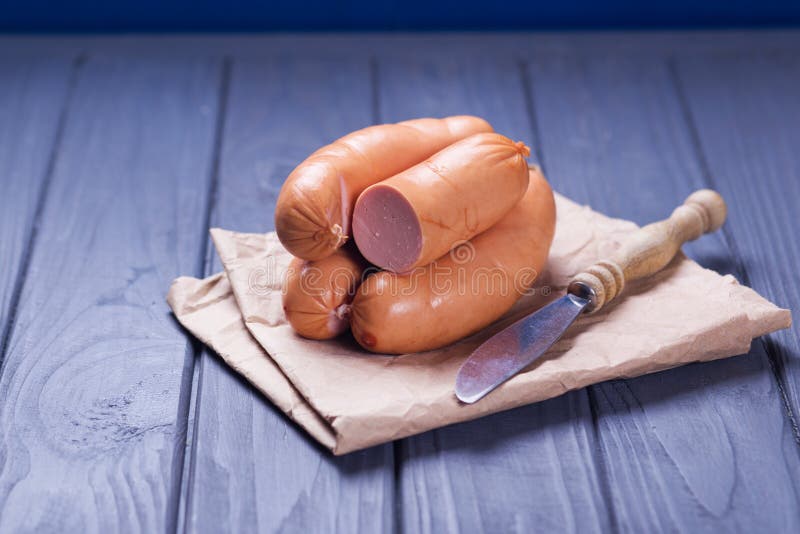 Fresh sausage on paper stock photo. Image of sausage - 106572100