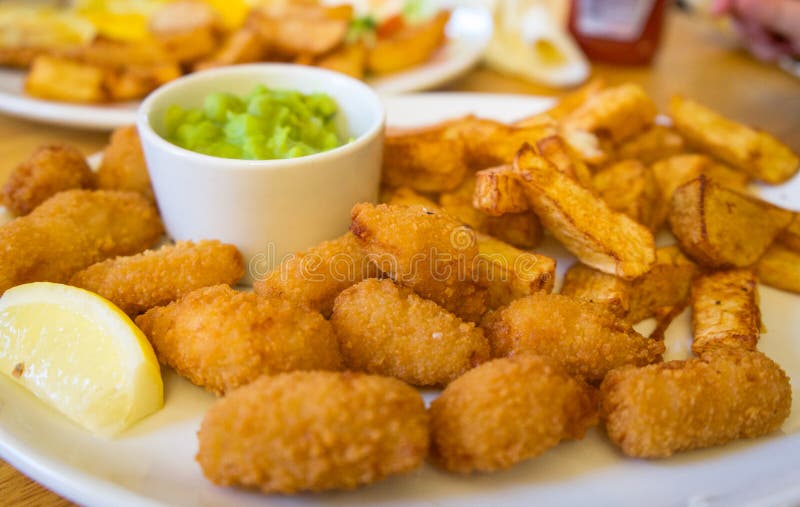 Scampi and Chips Popular British Pub Food, on a Plate, on a Wooden ...