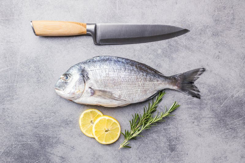 Fresh Sea Bream Fish on Kitchen Table. Top View Stock Photo - Image of ...