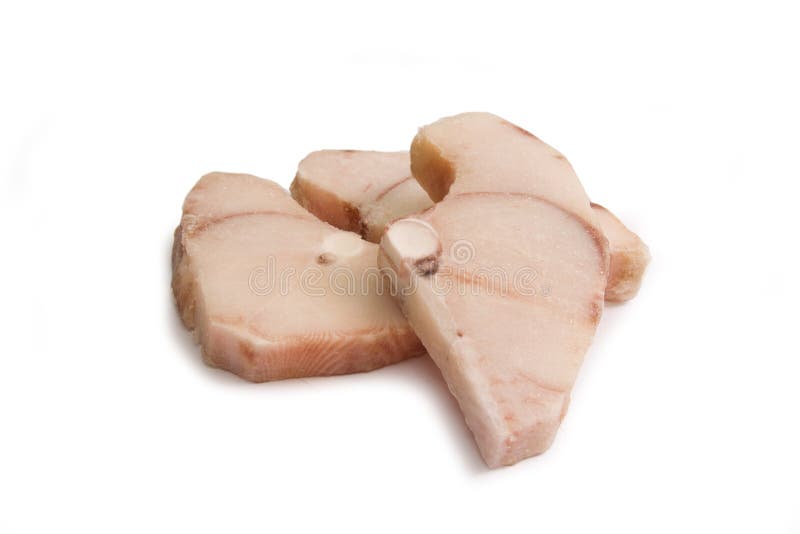 Fresh Sea White Fish, Cut into Pieces, Lies on a White Plate. Isolate ...