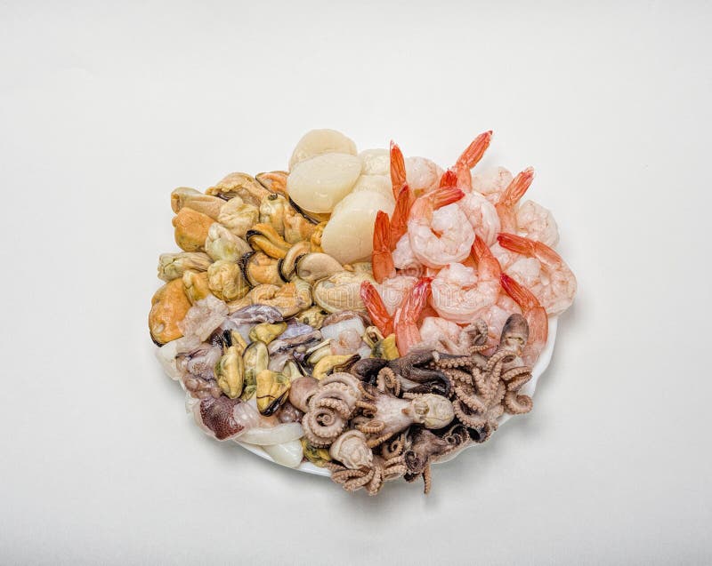 Fresh seafood on a plate stock photo. Image of fish, mussels - 79620872