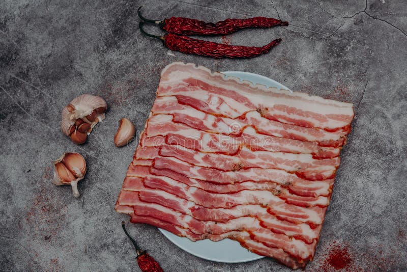 Fresh Sliced Bacon on a Gray Stone Background Stock Photo - Image of ...