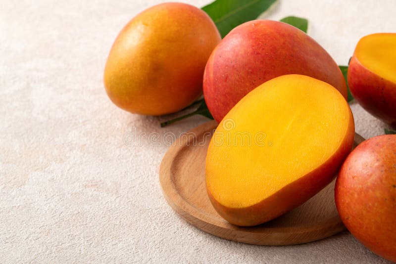 Fresh Slice Cut Juicy Mango on Gray Table Background with Leaf Stock ...