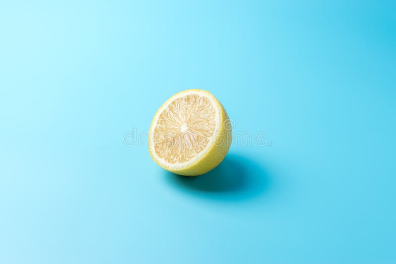 Fresh Sliced Lemon on Blue Background. Minimal Food Concept Stock Photo ...