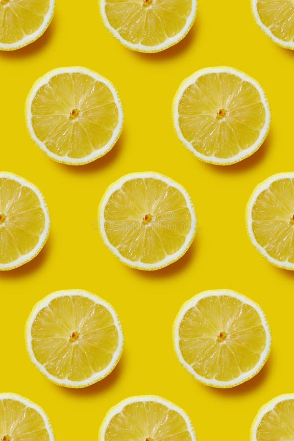 Fresh Sliced Lemon on Yellow Background, Infinite Pattern Stock Photo ...