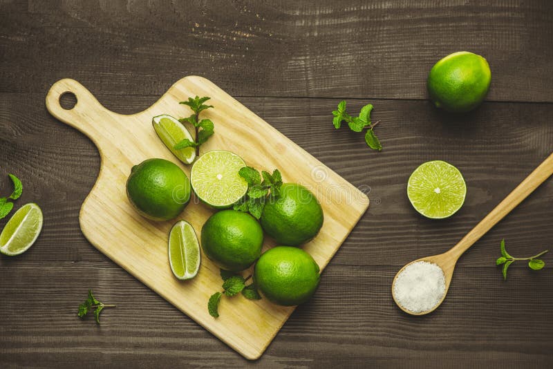 Fresh Sliced Lime and Salt on Wood Table Stock Photo - Image of lime ...