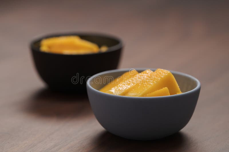 Fresh Sliced Mango in a Ceramic Bowls on Walnut Table Stock Image ...