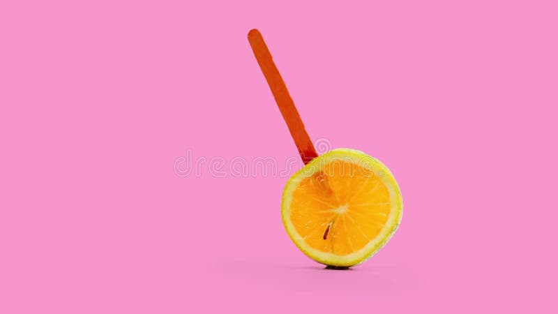 Sliced Orange Fruit on a Stick Rotating, Pink Background Stock Footage ...