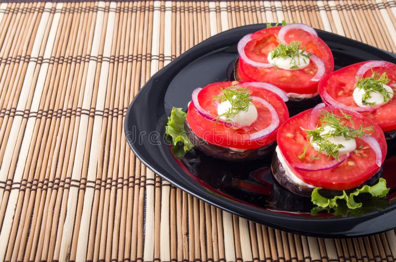 Fresh Sliced Tomatoes on a Black Plate Close-up Stock Photo - Image of ...