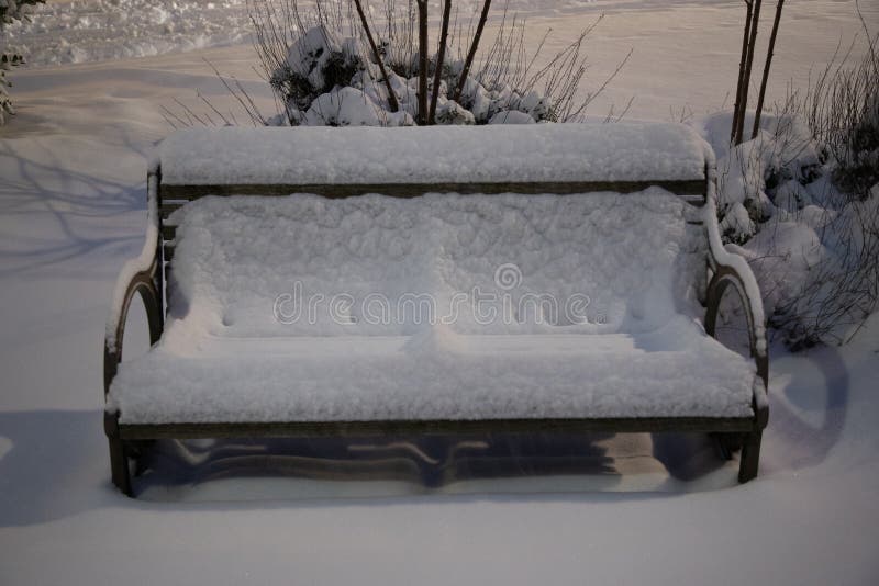 Snow covered park bench stock image. Image of landscape - 219502009
