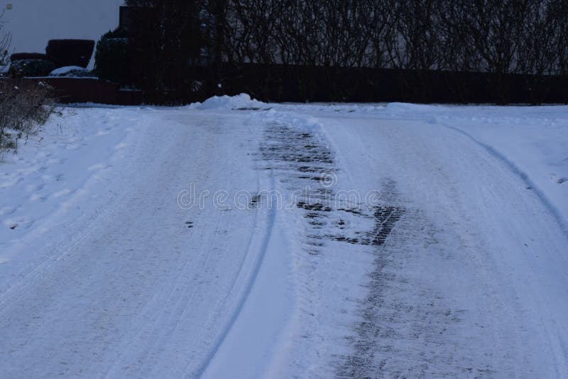 Tire tracks in deep snow stock image. Image of lane - 264161769