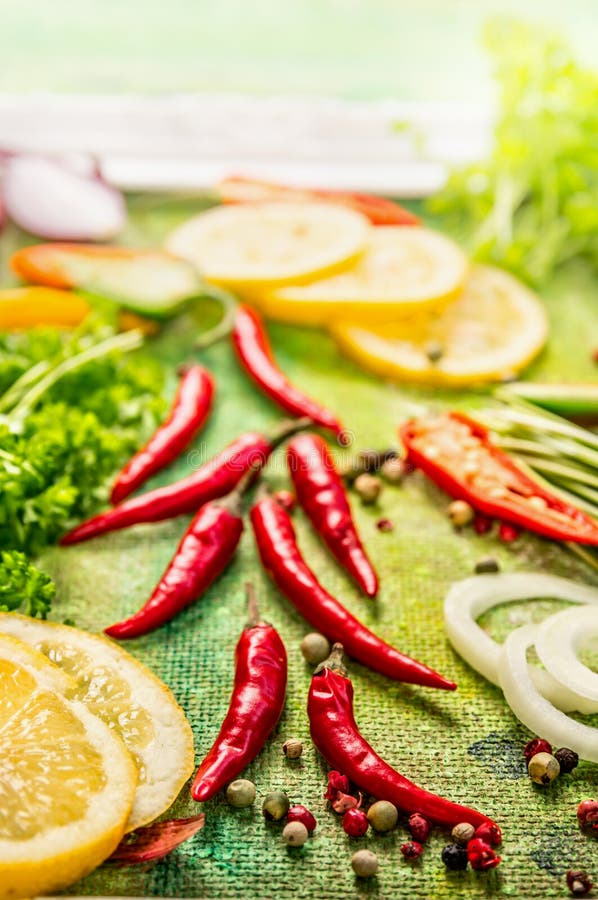 Fresh Spices and Herbs with Lemon on Green Background Stock Image ...