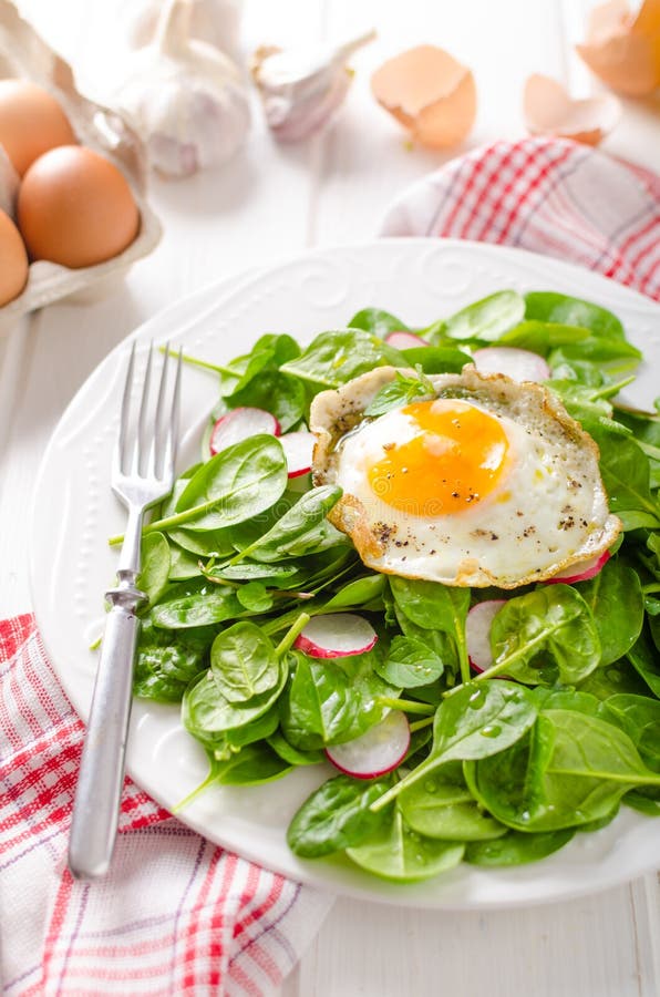 Fresh Spinach, Radish Salad with Fried Egg Stock Image - Image of ...