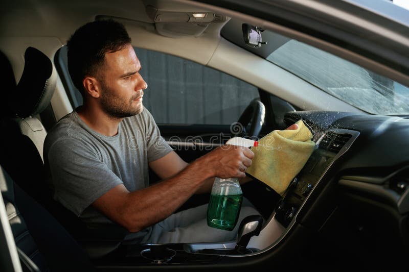 Fresh Spray. Man is Cleaning Interior of His Car Stock Image - Image of ...