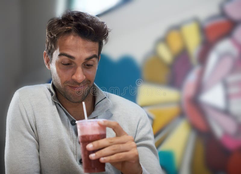Fresh Squeezed Refreshment. a Handsome Man Drinking a Smoothie at a ...