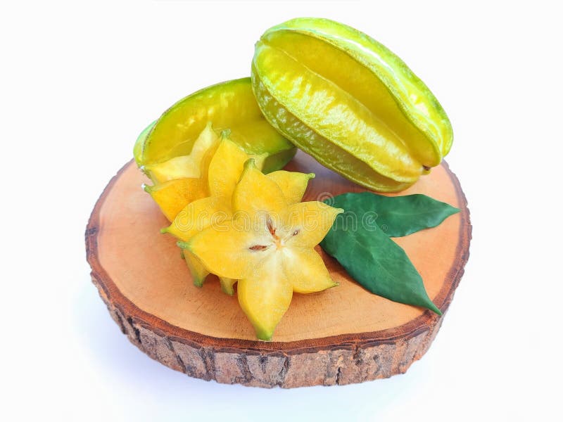 Fresh Star Fruit and Pieces of Star Fruit on a Round Wooden Tray on a ...