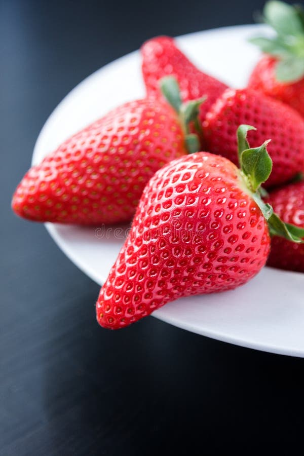 Fresh Strawberries on Plate on Black Background Stock Photo - Image of ...